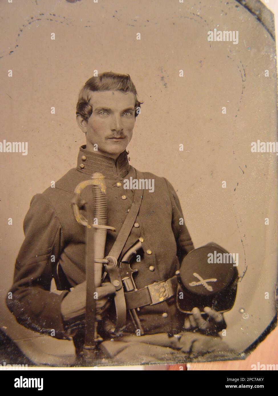 Unidentified soldier in Union uniform holding kepi with cavalry ...