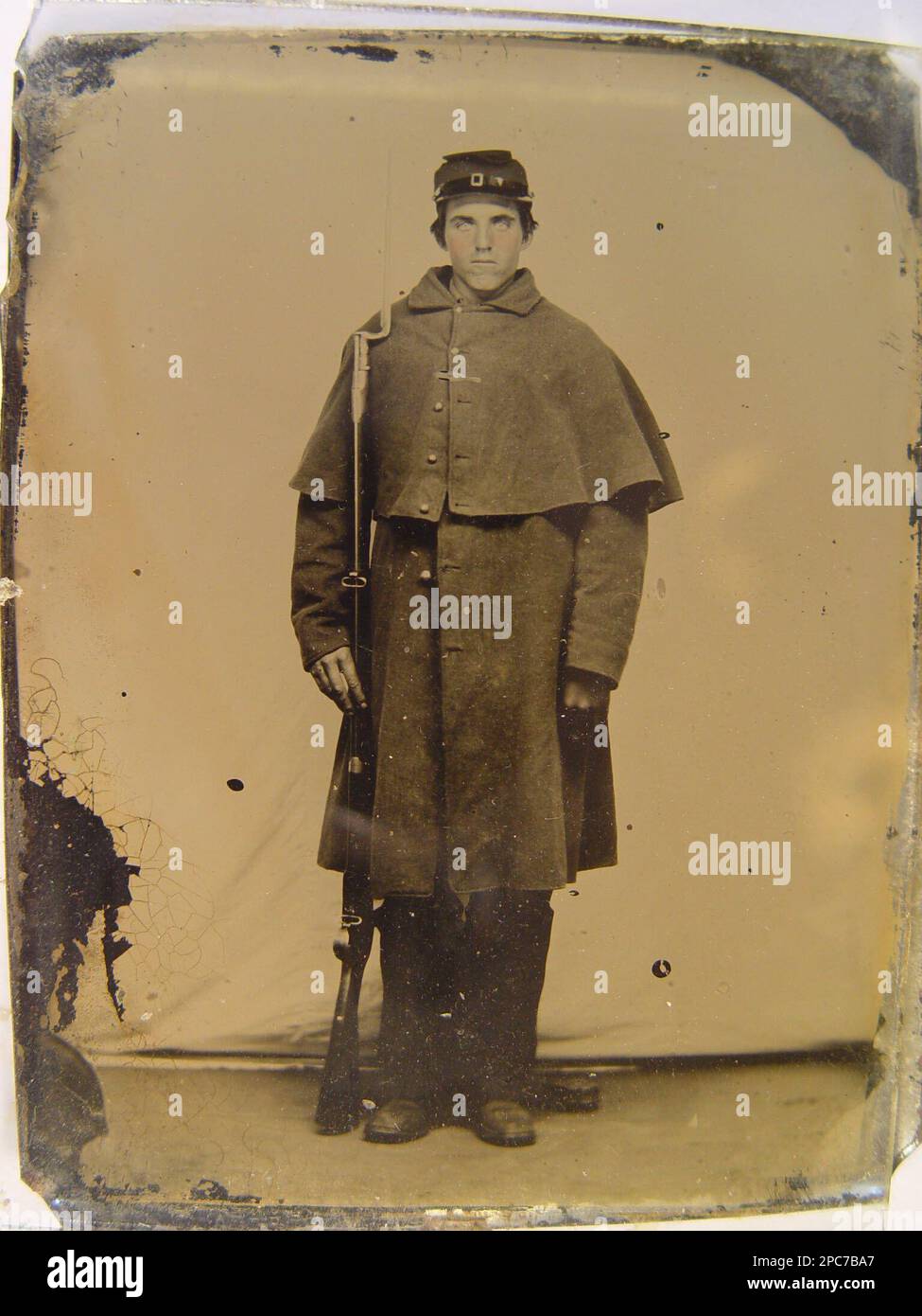 Unidentified soldier in Union greatcoat with forage hat standing with ...