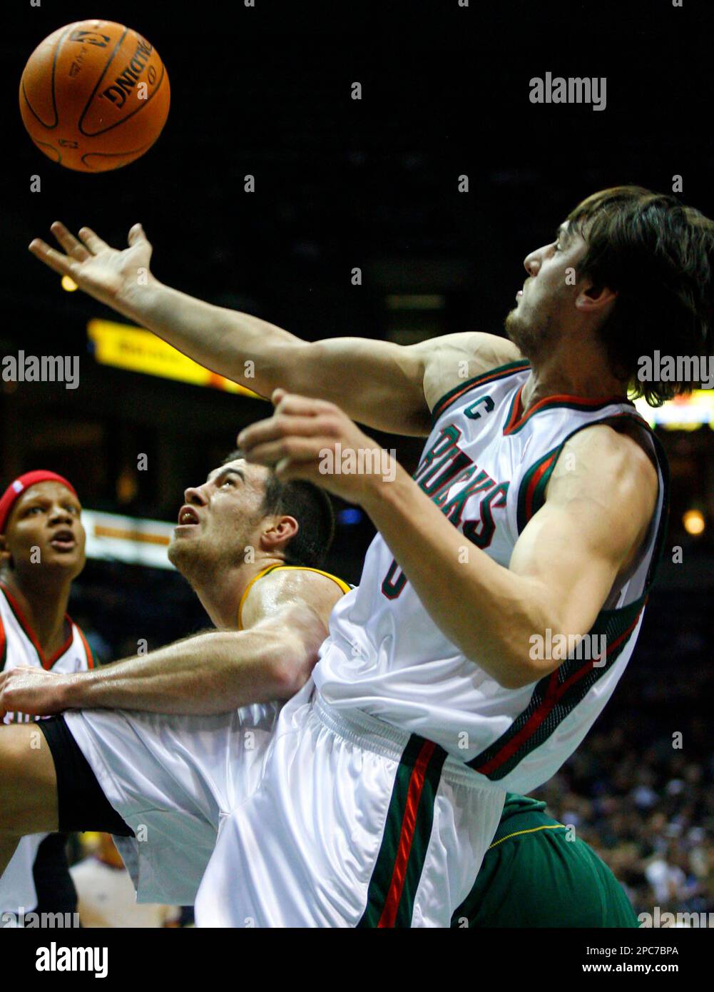 Milwaukee Bucks Andrew Bogut, right, battles for the ball with Seattle ...