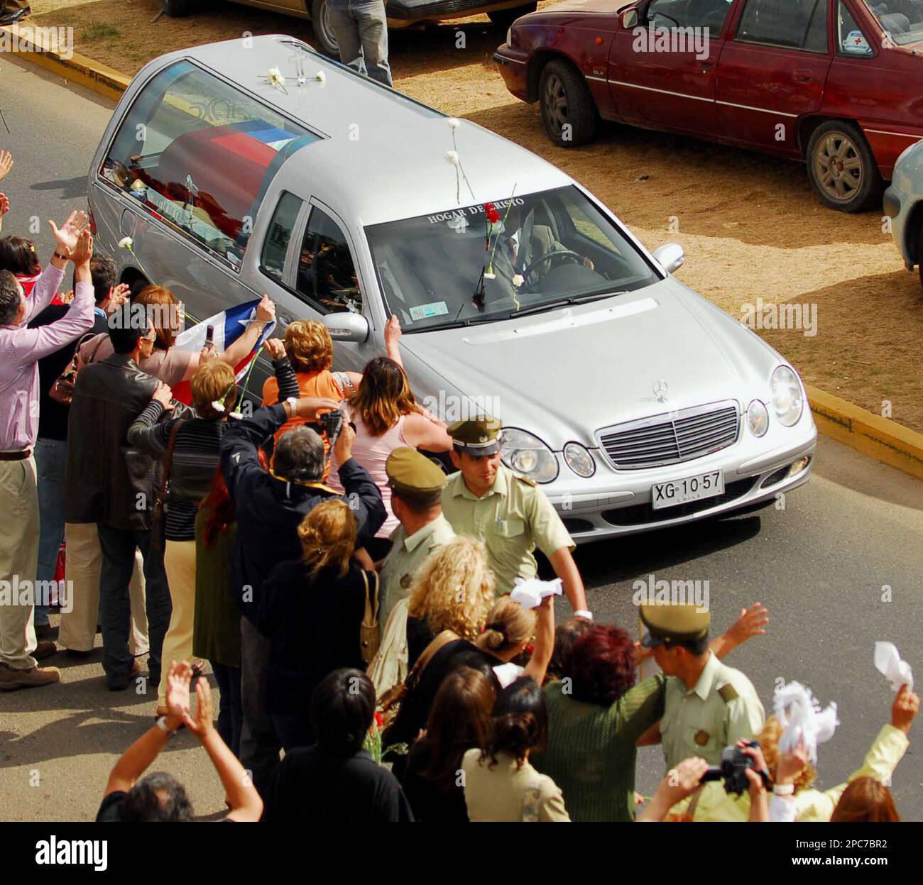 Supporters of former dictator Gen. Augusto Pinochet wave while the ...