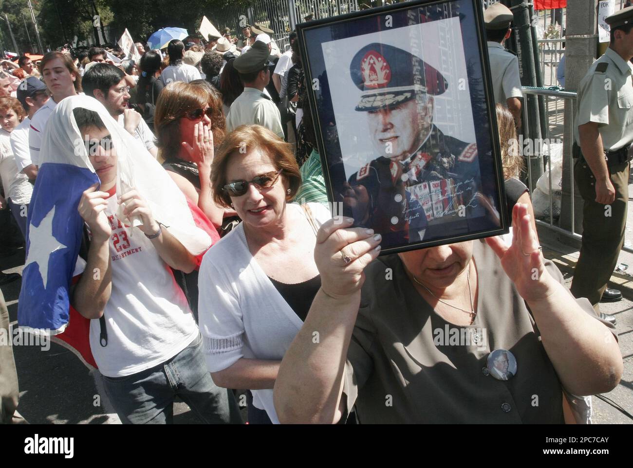 Pinochet's supporters gather outside the Military Academy as they try ...