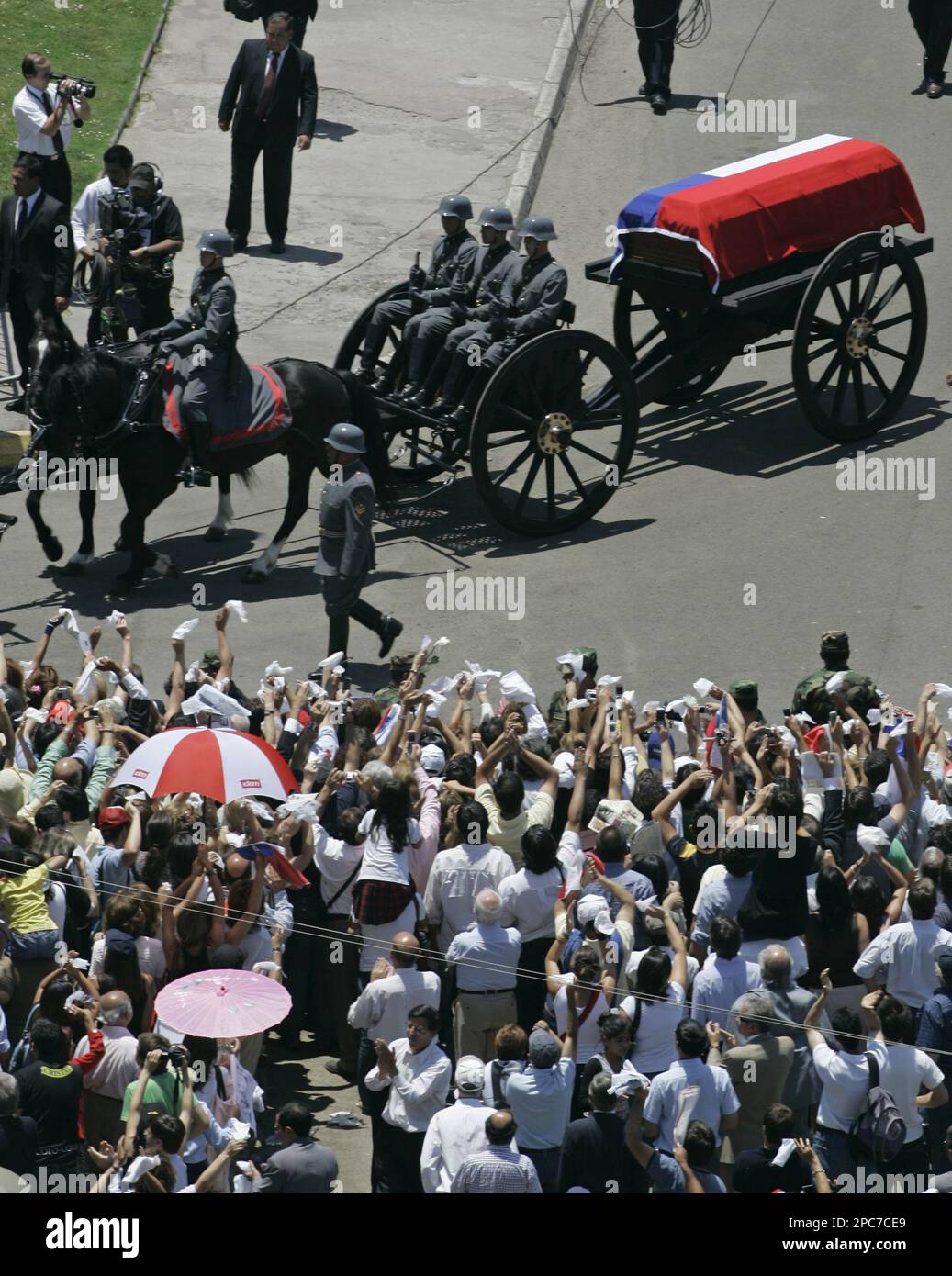 Pinochet's supporters give a farewell to the casket with the remains of ...