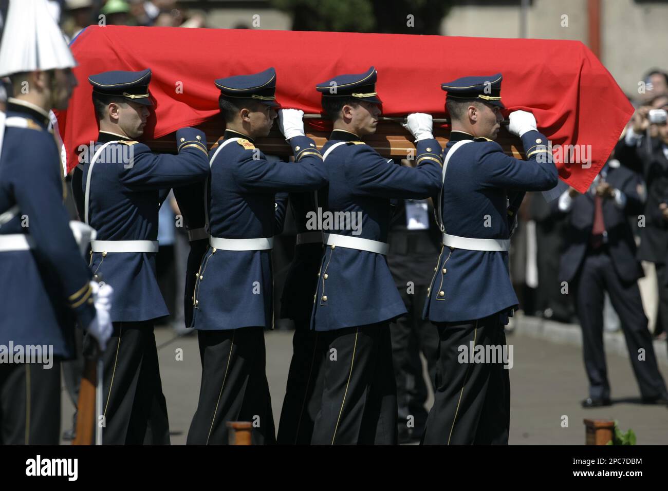 Honor Guard soldiers carry the coffin with the remains of former ...