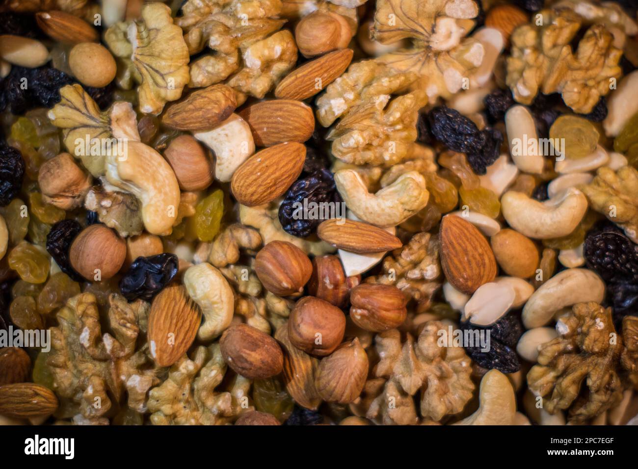 Mixed nuts background close up Stock Photo - Alamy