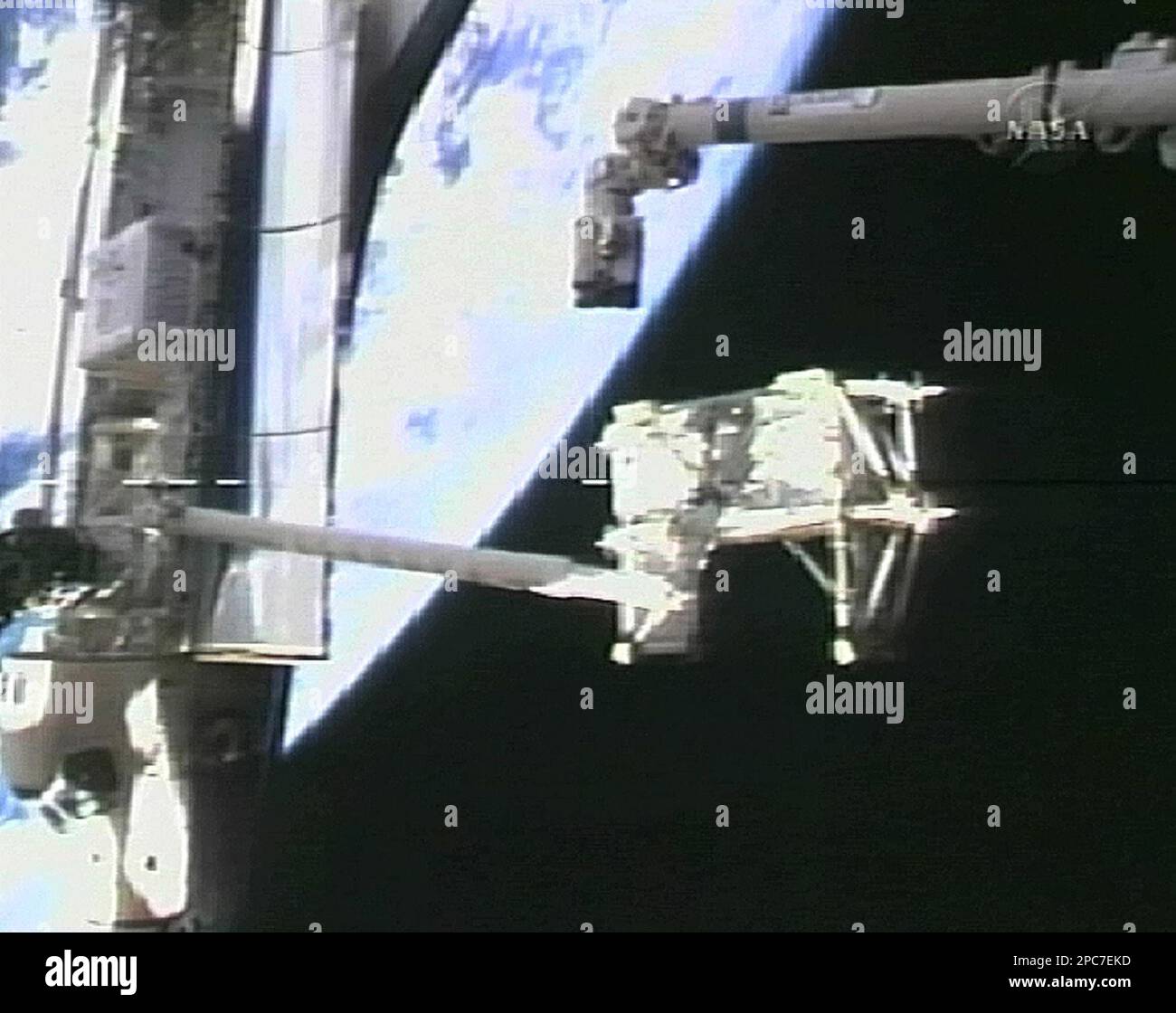 The P5 truss segment attached to space shuttle Discovery's robotic arm ...
