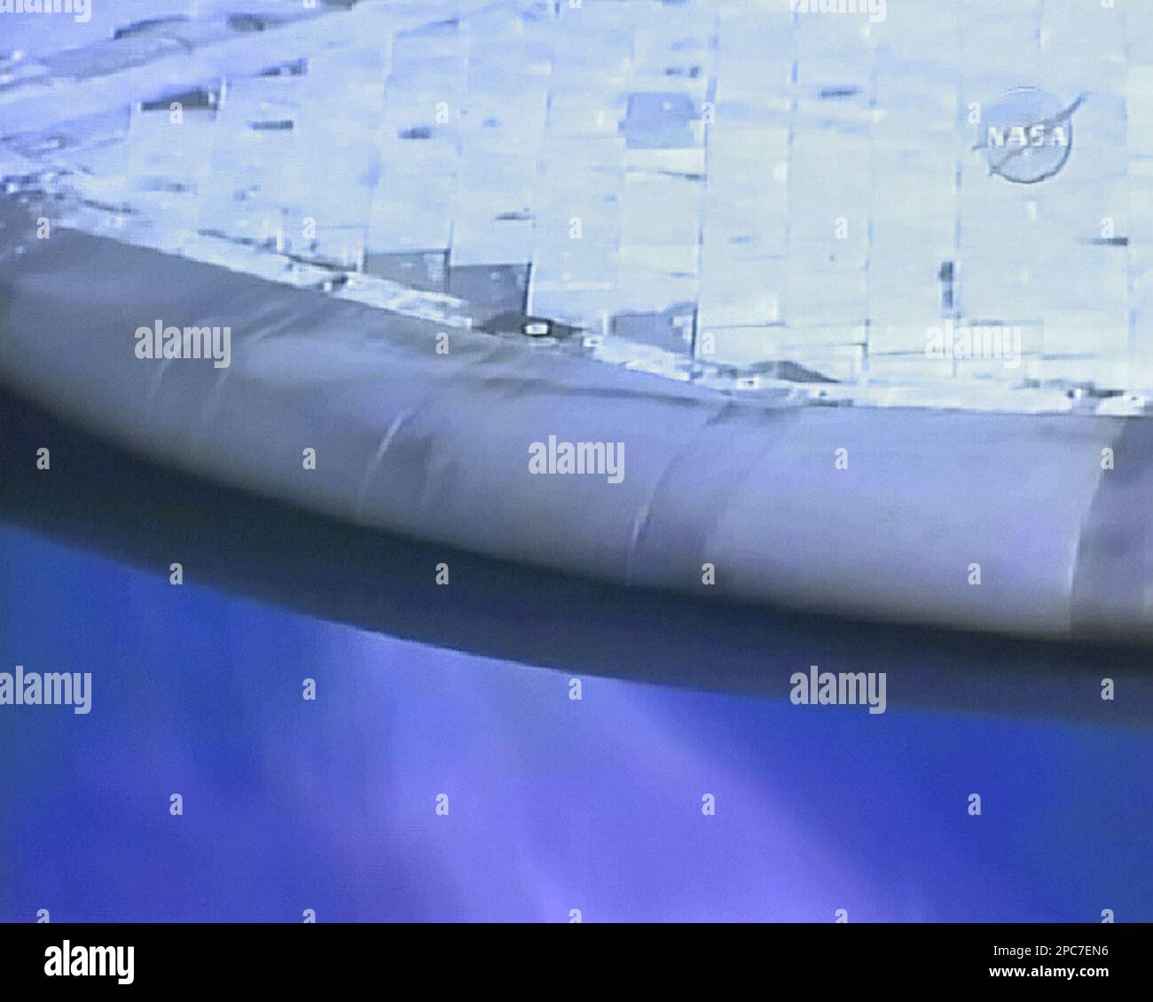 The left wing of space shuttle Discovery is inspected for possible ...