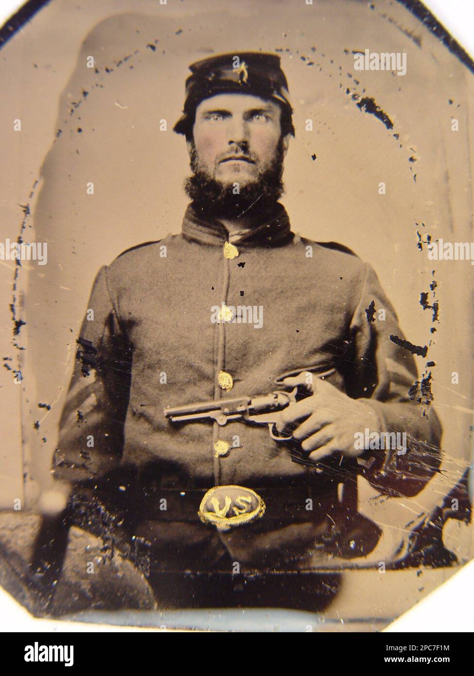 Unidentified soldier in Union corporal's uniform holding revolver to ...