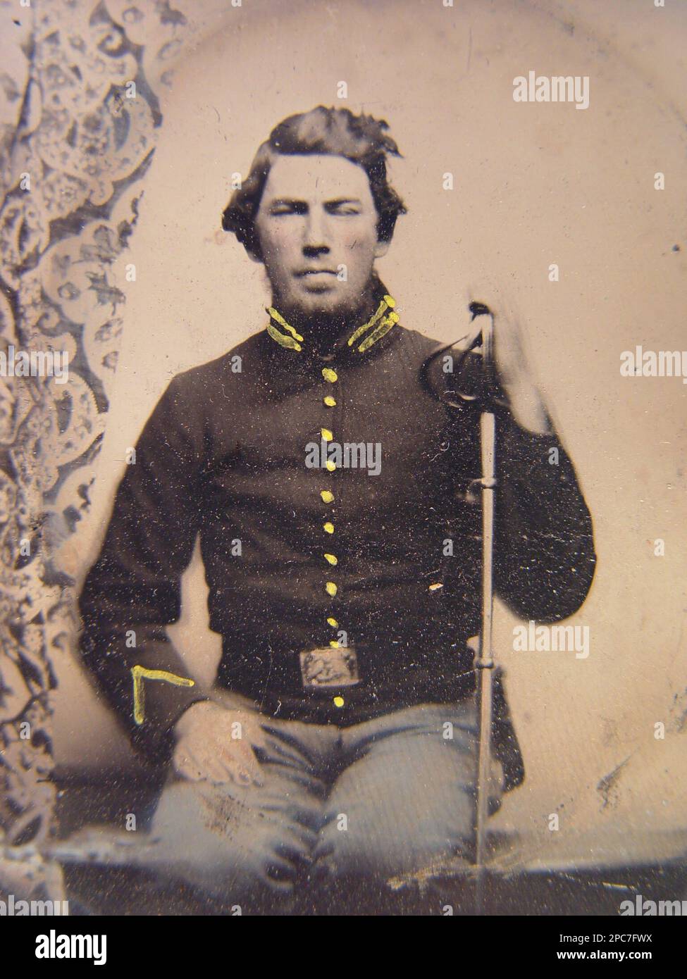 Unidentified soldier in Union cavalry uniform sitting with saber ...