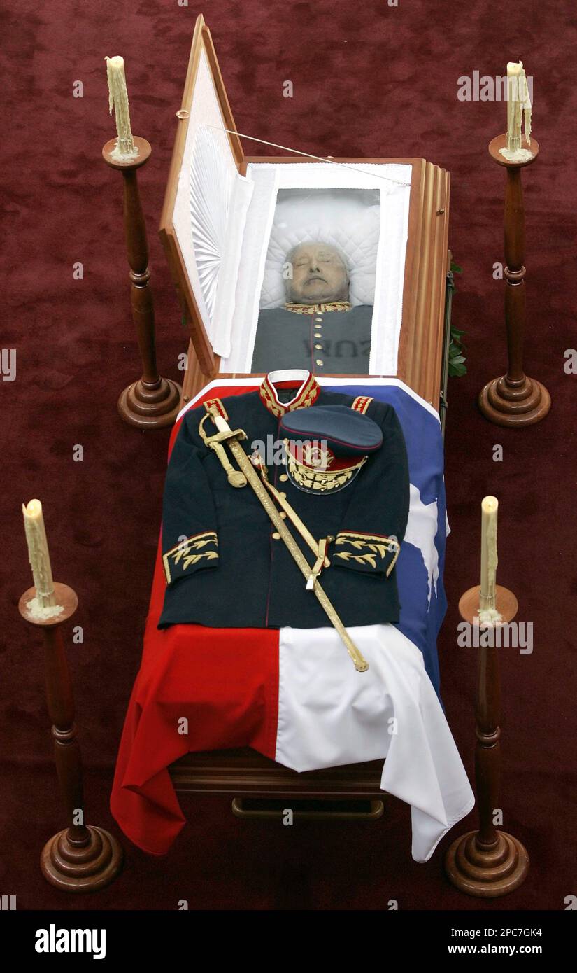 The body of former military ruler Gen. Augusto Pinochet is seen inside ...