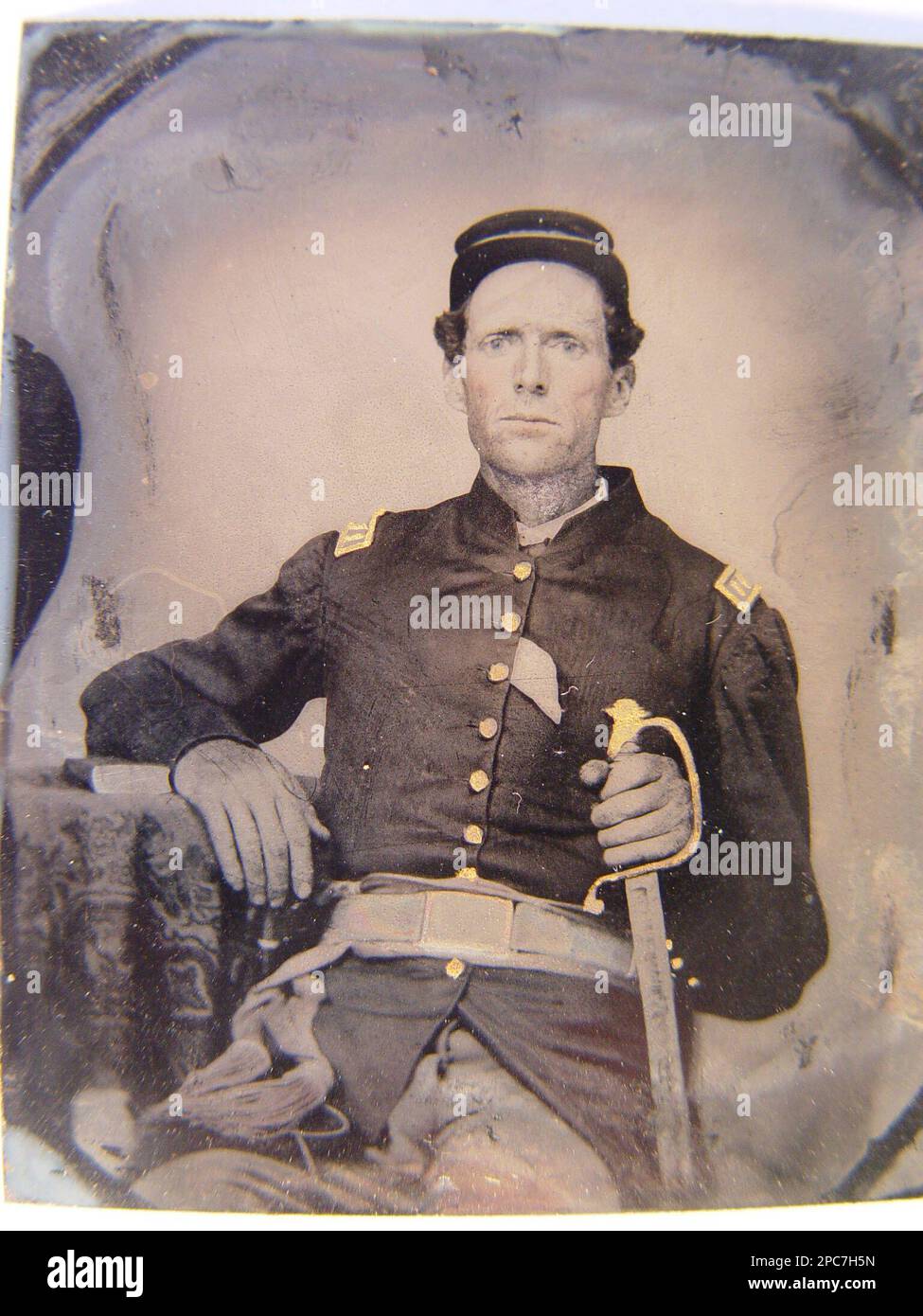 Unidentified soldier in Union captain's uniform with artillery saber ...