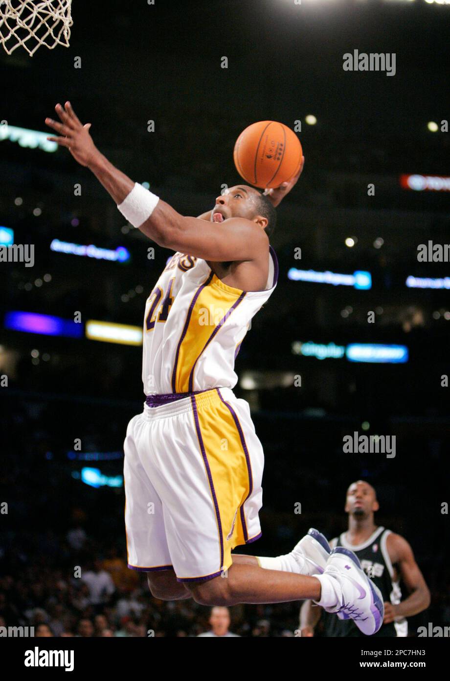 Los Angeles Lakers' Kobe Bryant goes up to dunk the ball as San Antonio ...
