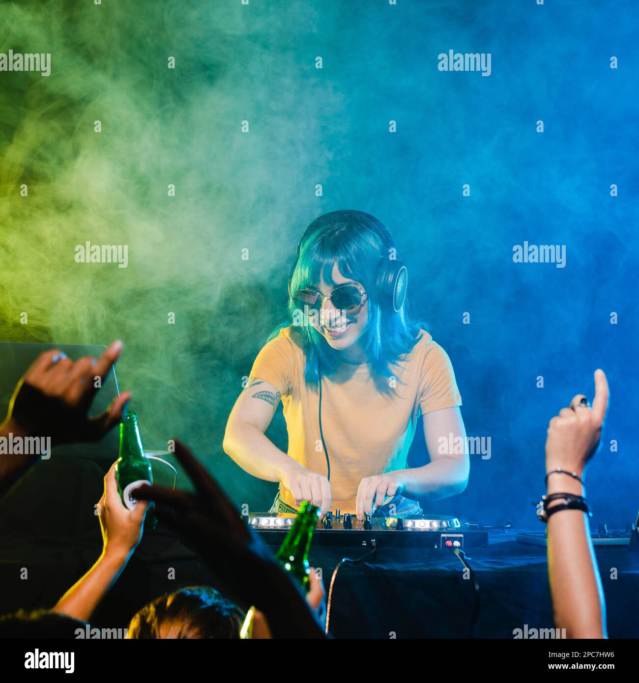 happy female dj entertaining big crowd. High resolution photo Stock ...