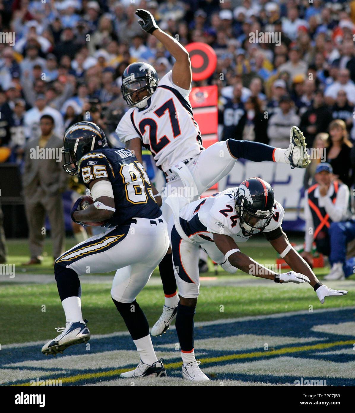 San Diego Chargers tight end Antonio Gates (85) sends Denver Broncos ...
