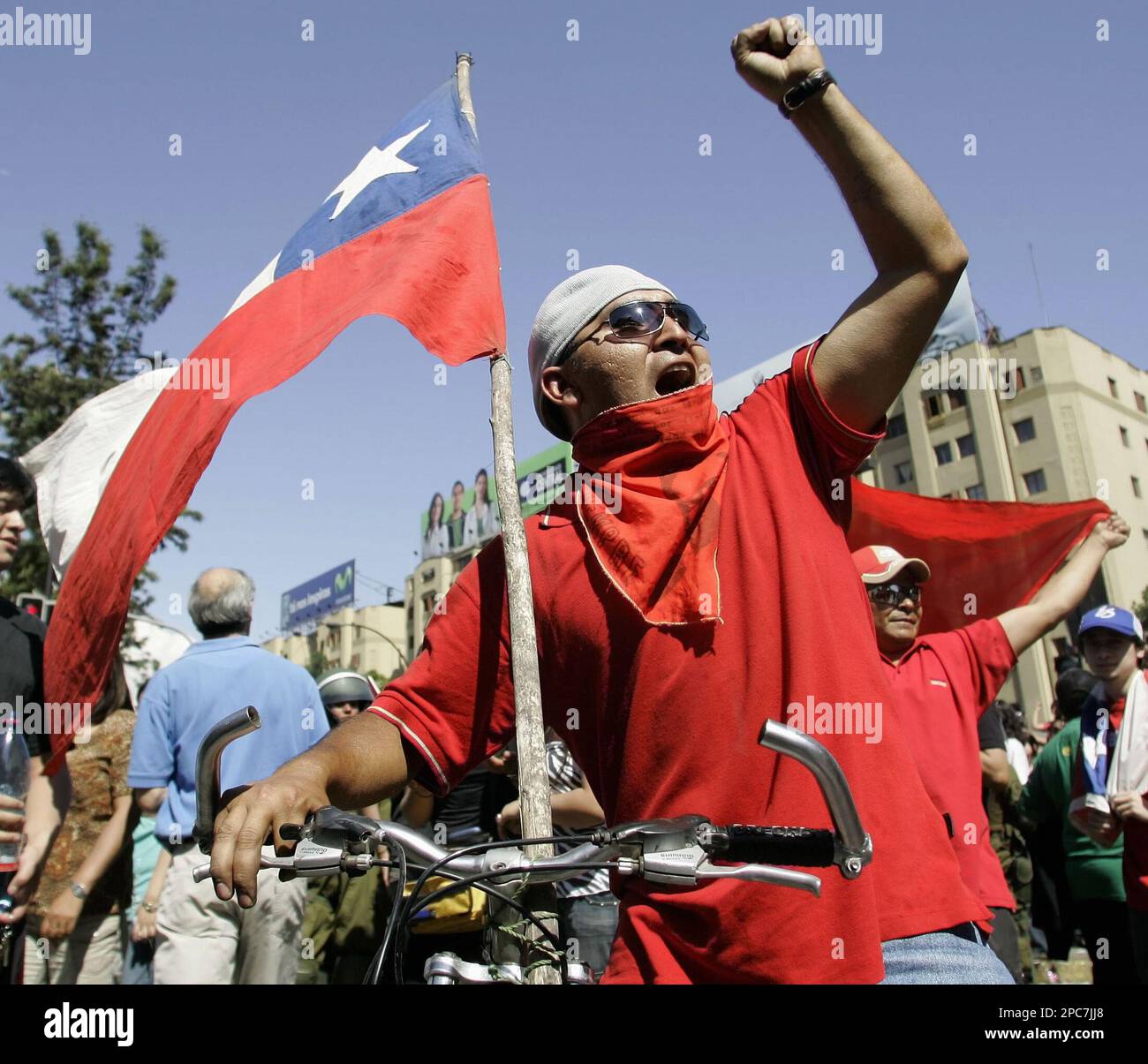 An opponent of former Chile's dictator Augusto Pinochet celebrates his ...