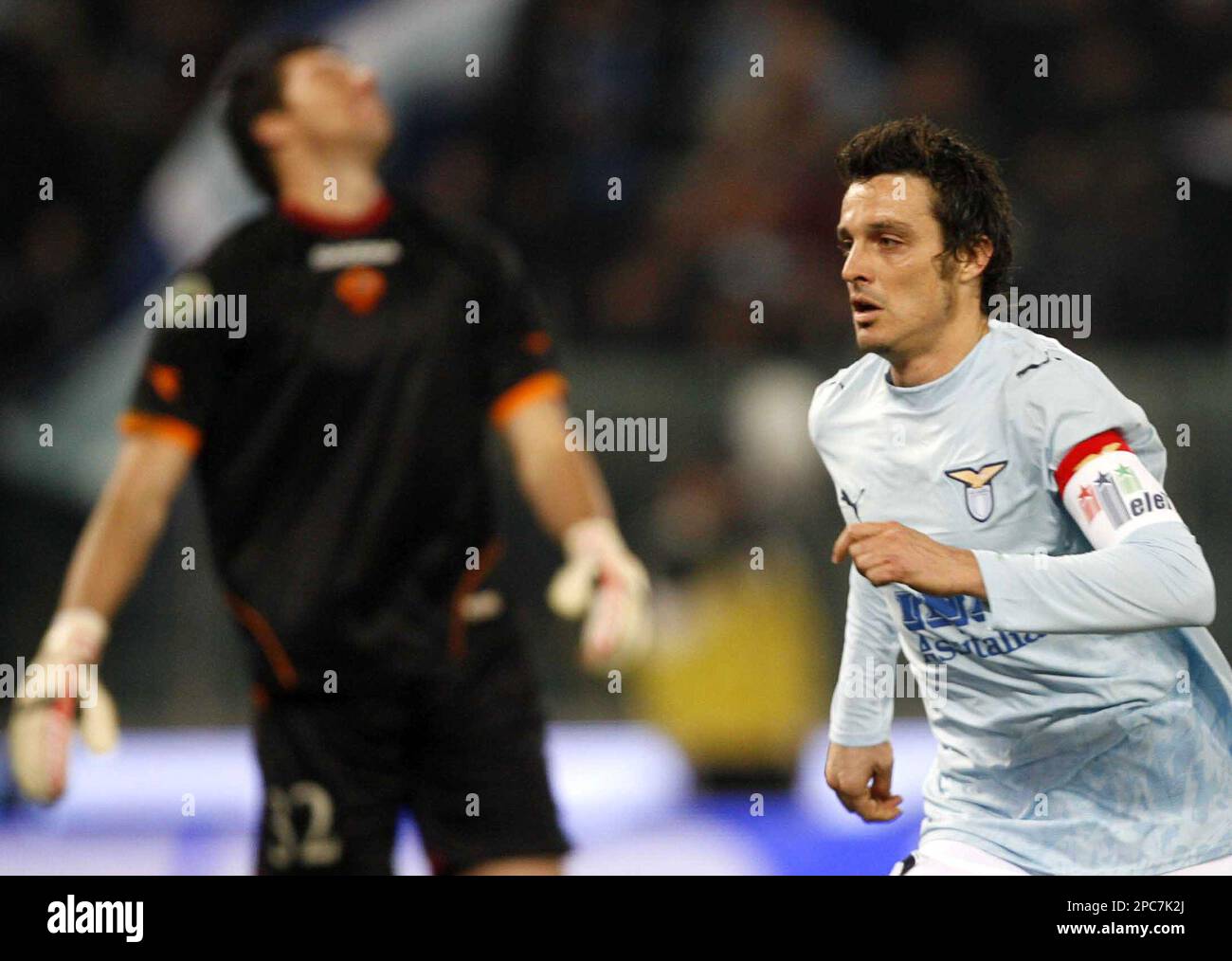 Lazio's Massimo Oddo celebrates after scoring on a penalty kick during ...