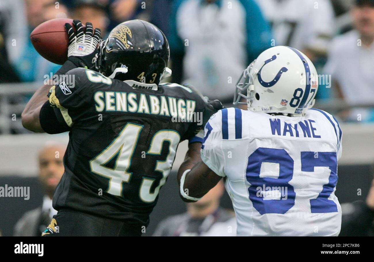 Jacksonville Jaguars defensive back Gerald Sensabaugh, left, intercepts ...