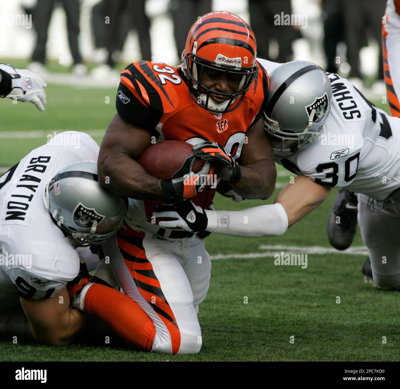 Cincinnati Bengals running back Rudi Johnson (32) is tackled by Oakland ...