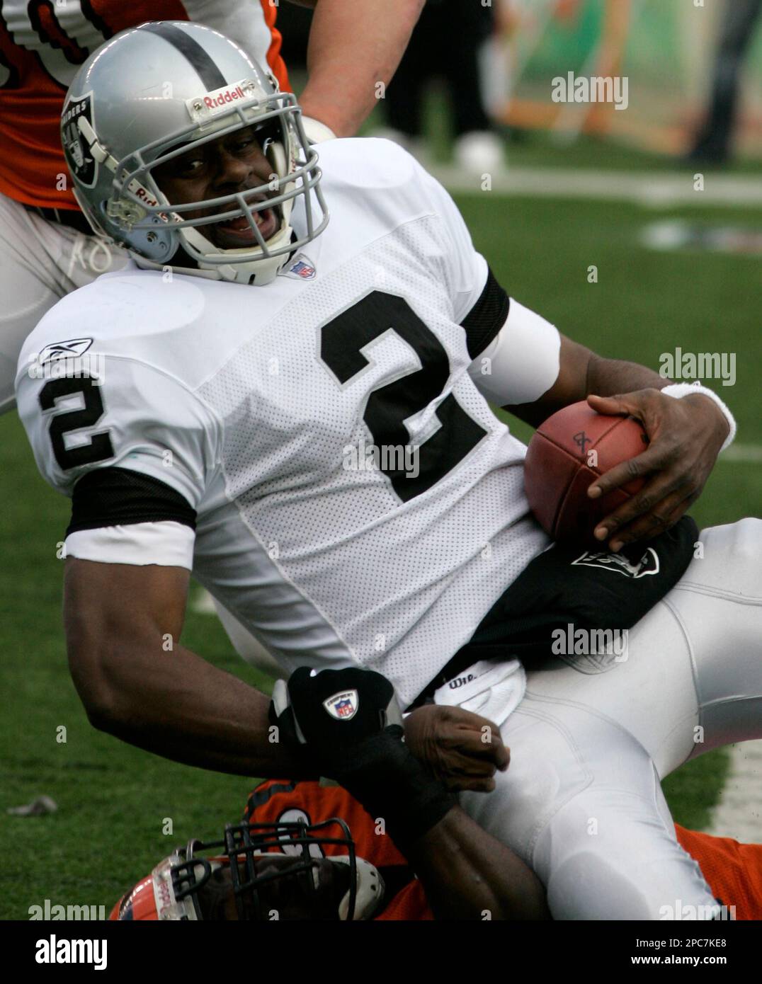 Oakland Raiders quarterback Aaron Brooks (2) is sacked by Cincinnati ...