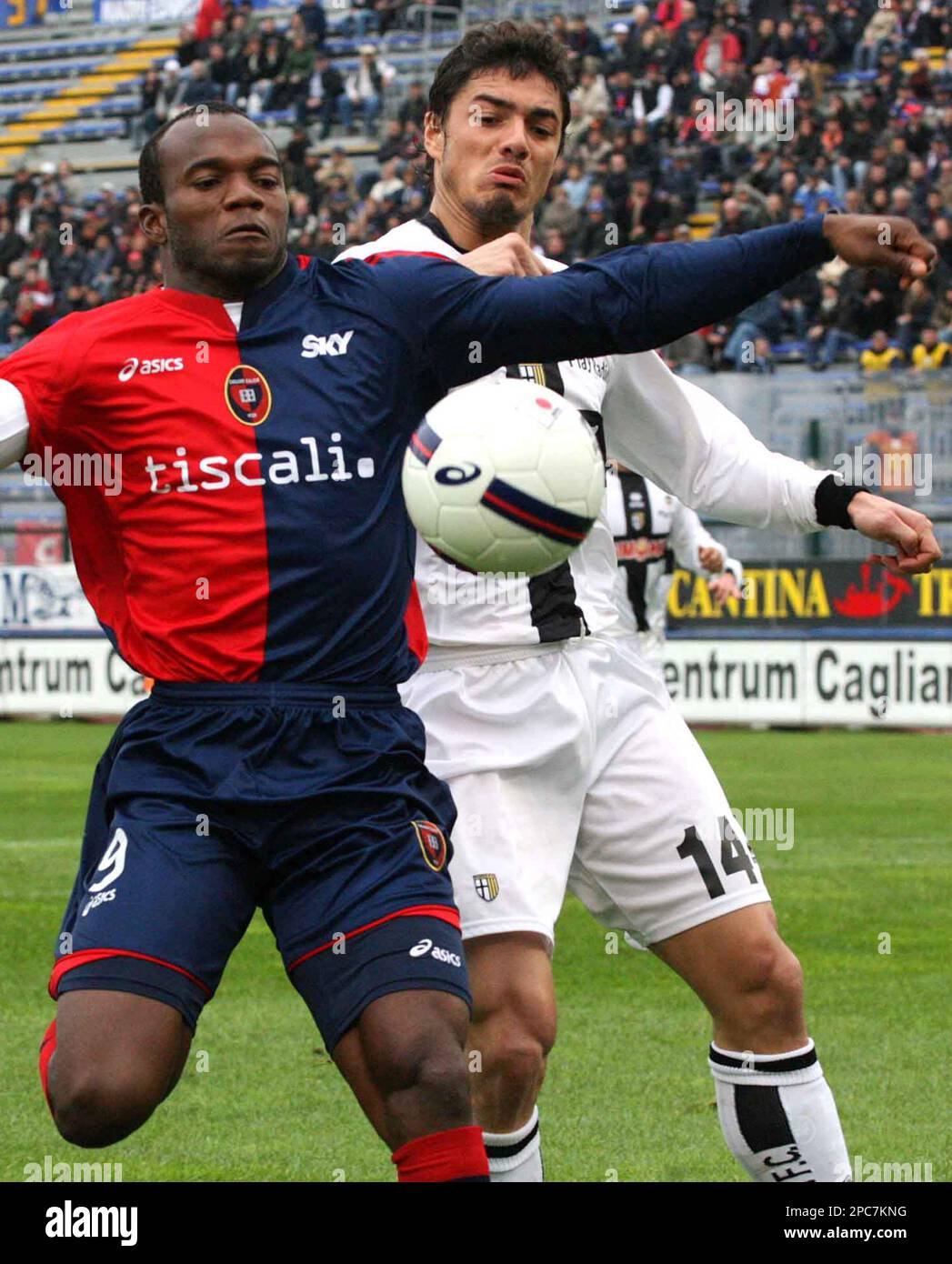Cagliari's striker David Suazo, left, is pursued by Parma's defender ...