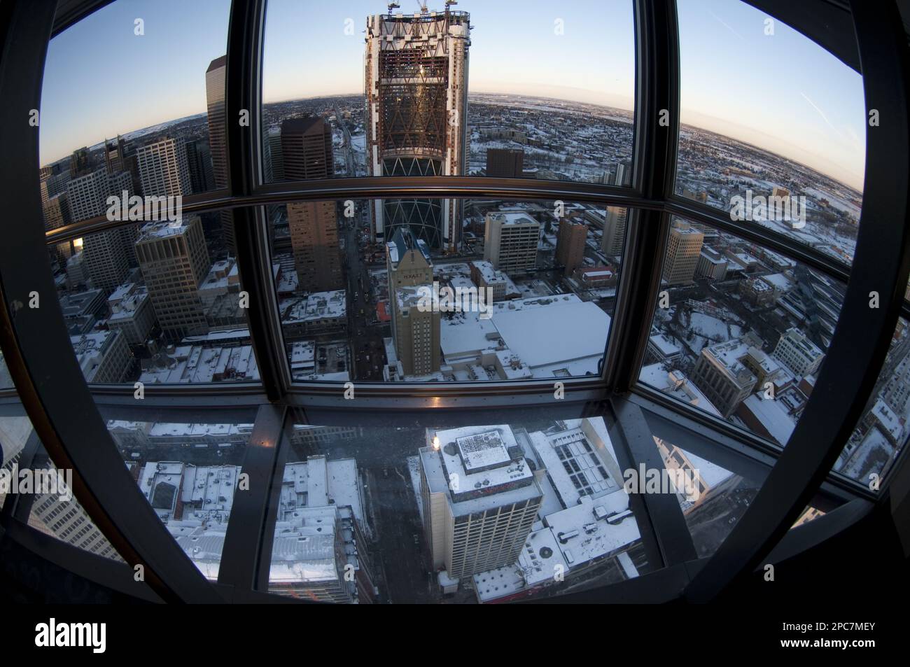 View of the snow-covered city from the observation tower, Calgary Tower ...