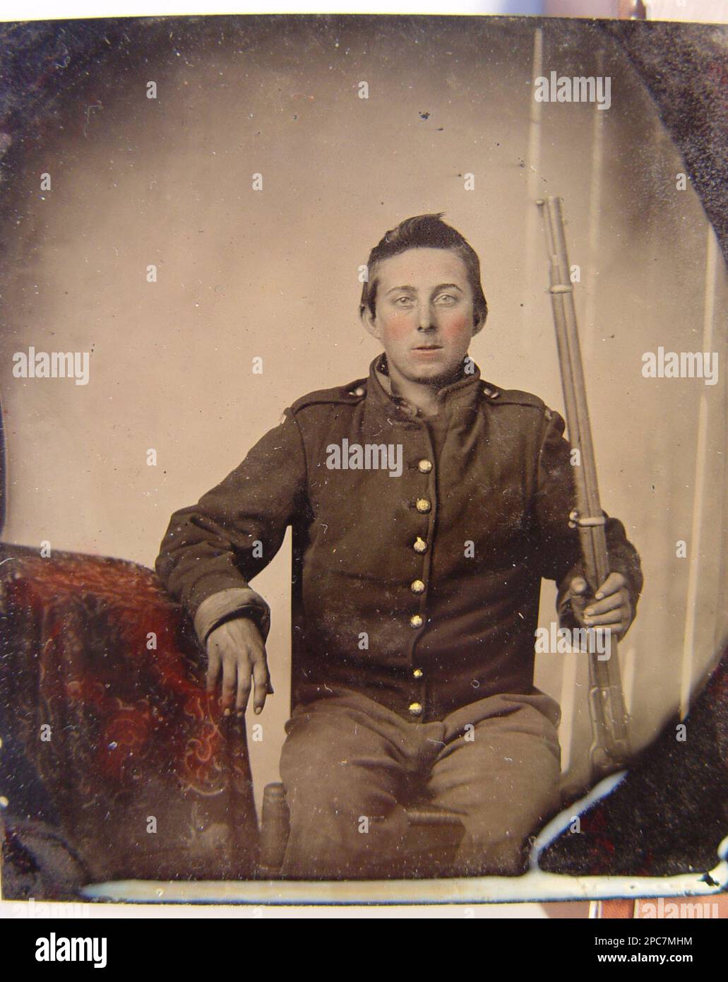 Unidentified young soldier in Union uniform holding Colt revolving ...