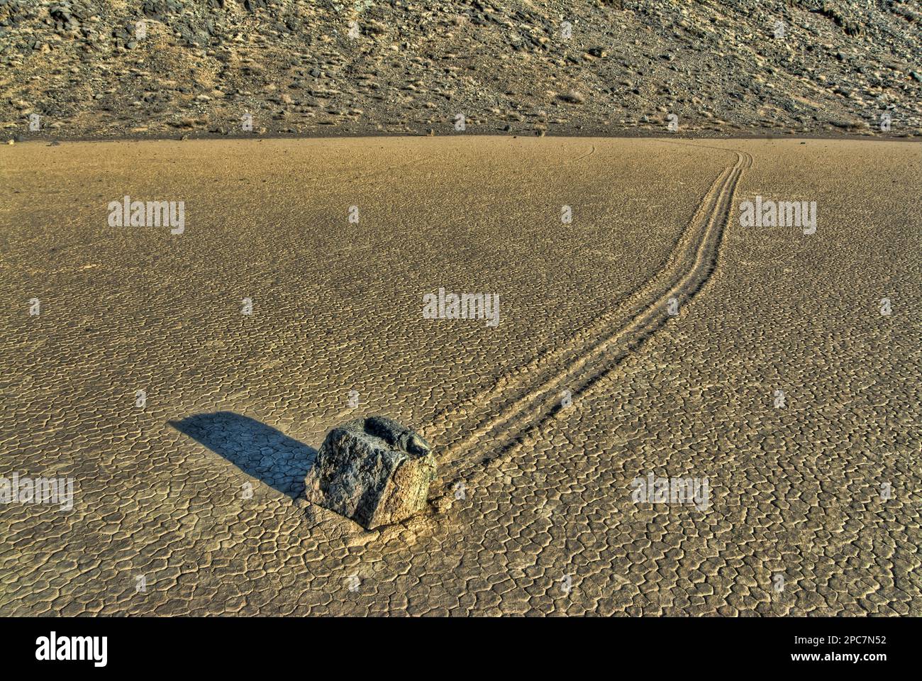 'Sailing stones' geological phenomenon of rocks moving along tracks on ...