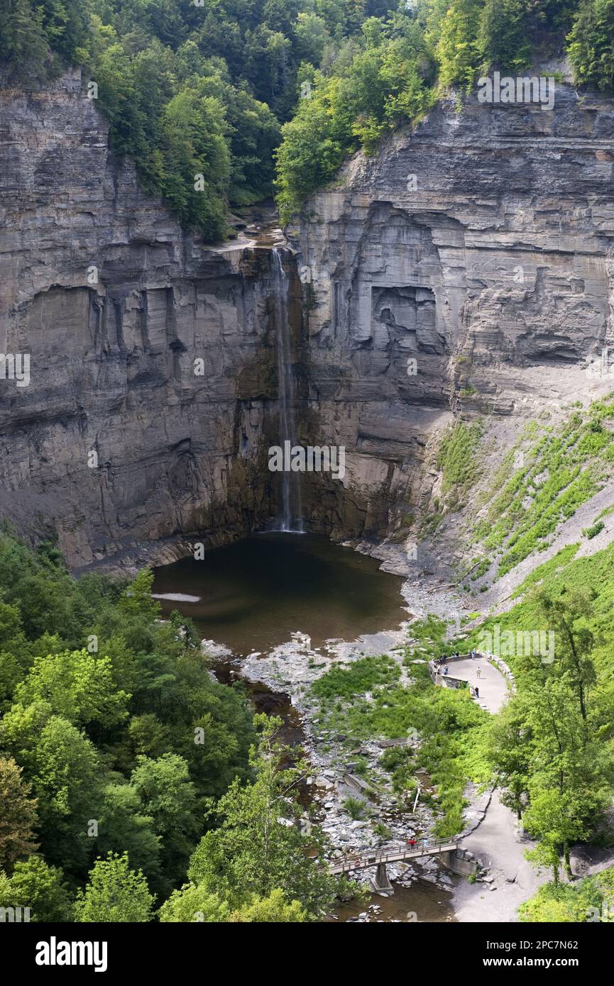 View of waterfall flowing over gorge cliff, Taughannock Falls ...