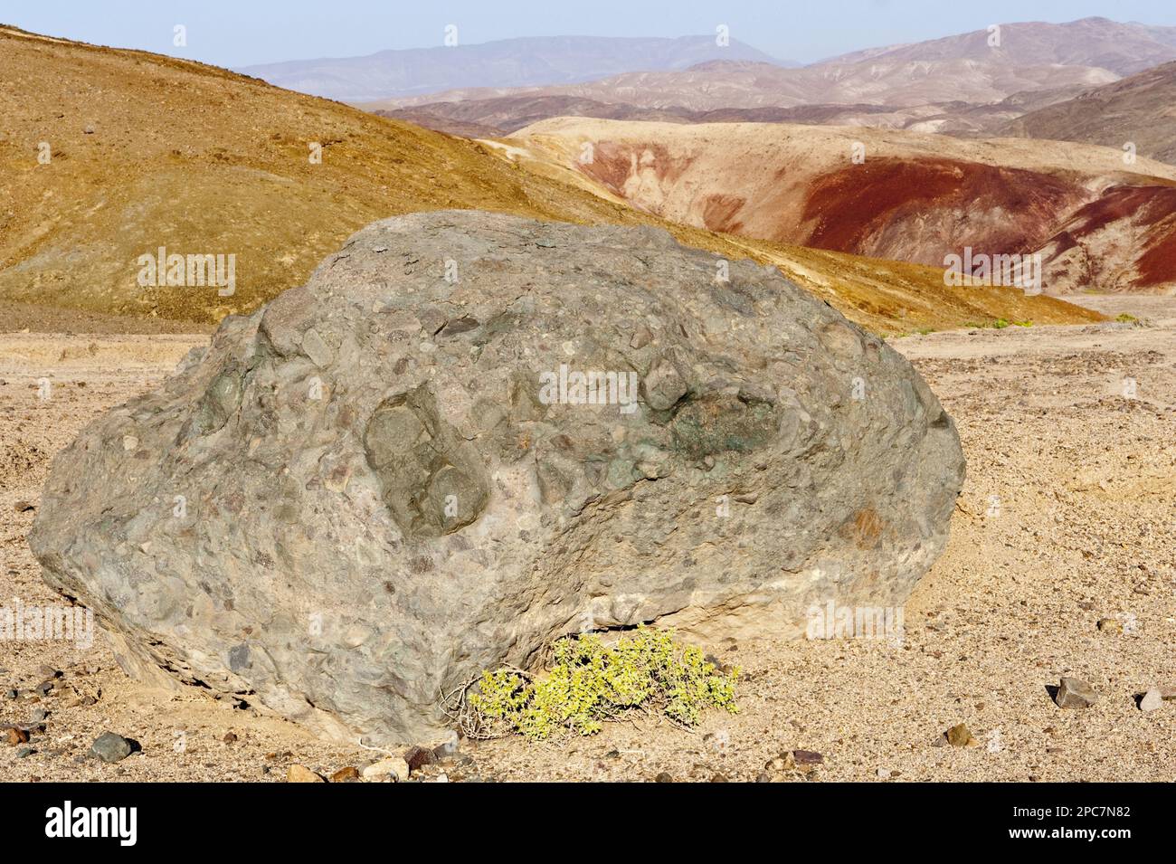 Rock outcrop in the desert, mountains coloured by minerals, during ...