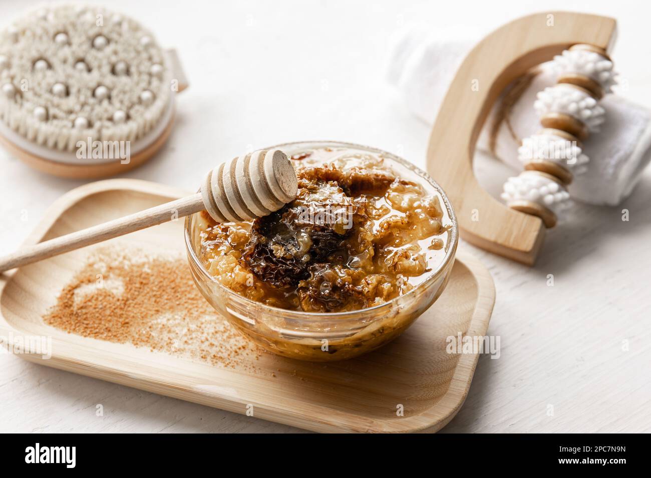 Spa composition with honey and dipper close up Stock Photo - Alamy