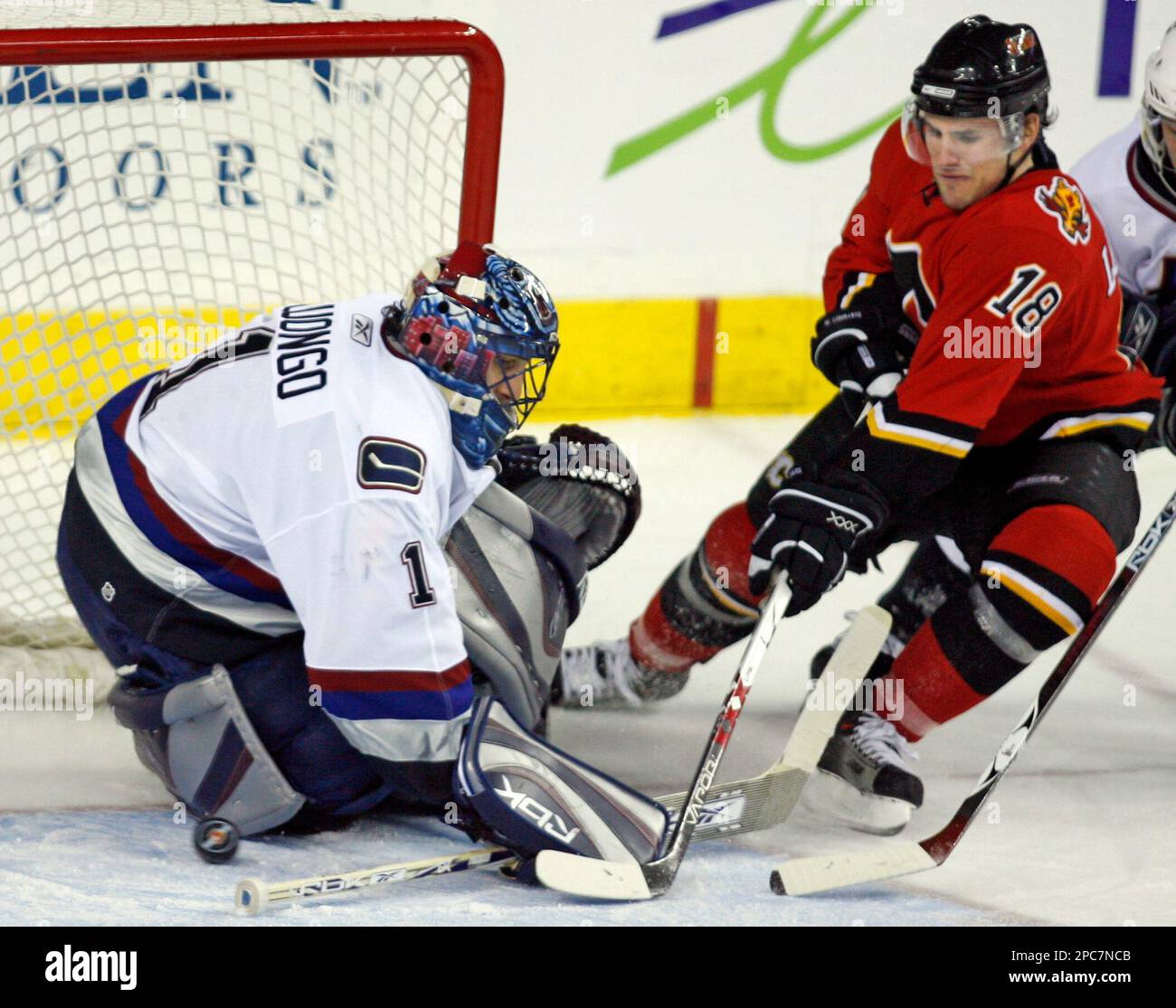 Calgary Flames' Matthew Lombardi, right, scores the Flames' fourth goal ...