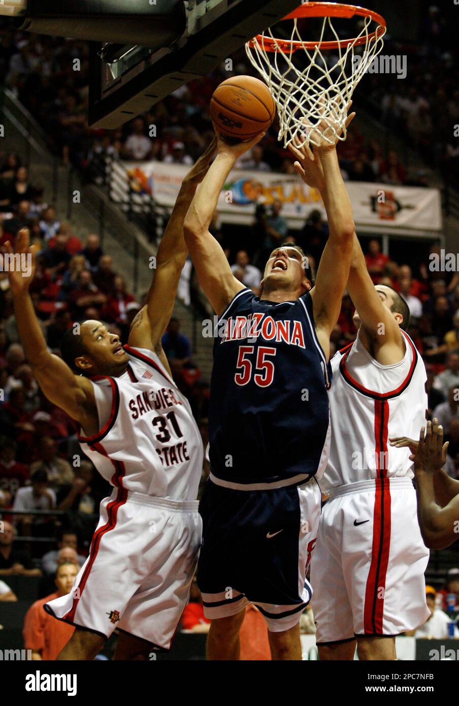 Arizona's Ivan Radenovic (55) shoots between San Diego State's Richie ...