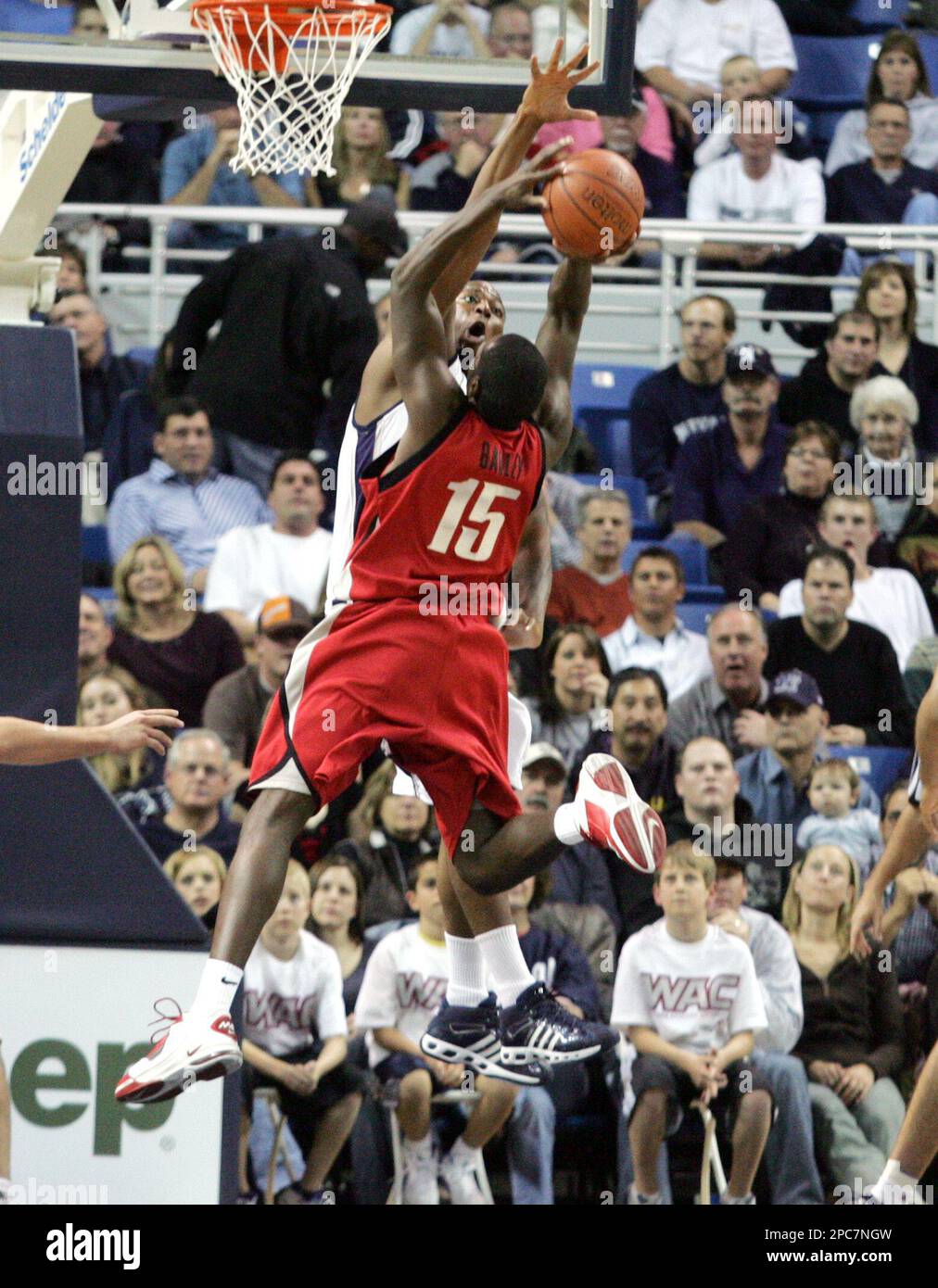 Nevada guard Marcelus Kemp attempts to block the shot of UNLV forward ...