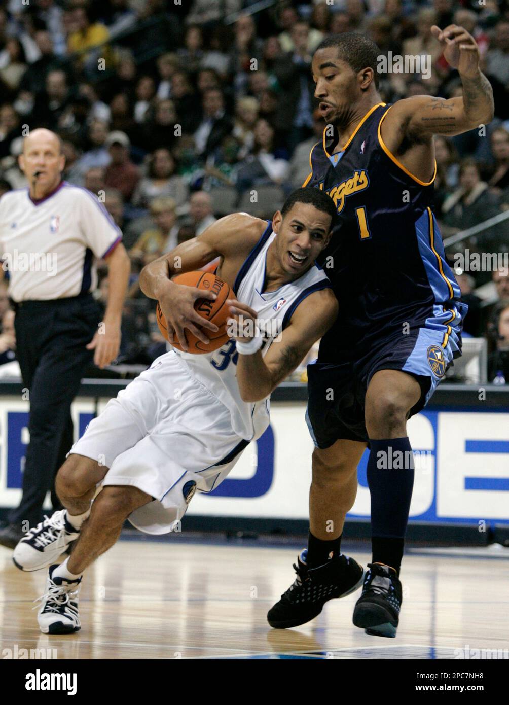 Dallas Mavericks' Devin Harris, foreground left, drives against Denver ...