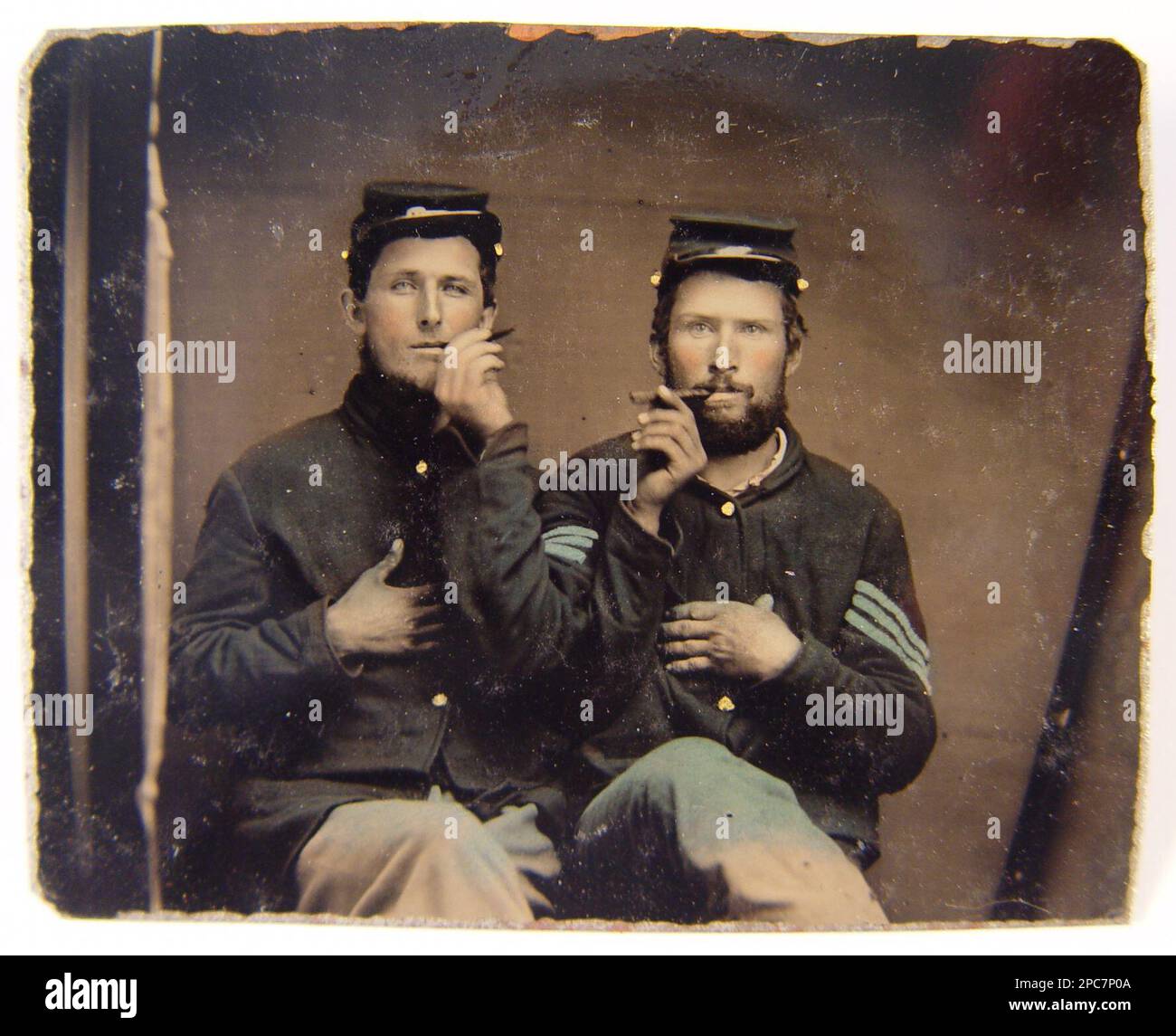 Two unidentified soldiers in Union uniforms holding cigars in each ...