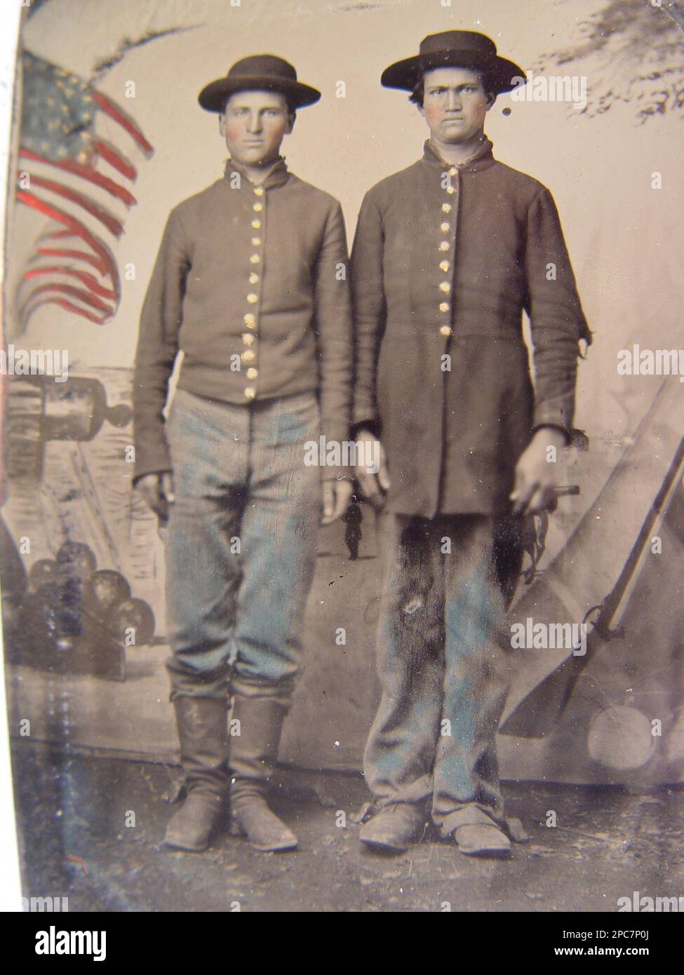Two unidentified young soldiers in Union uniforms in front of painted ...