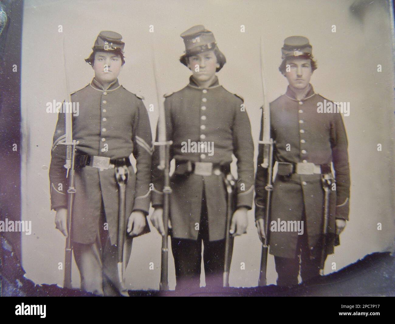 Three unidentified soldiers in Union uniforms with shoulder scales and ...
