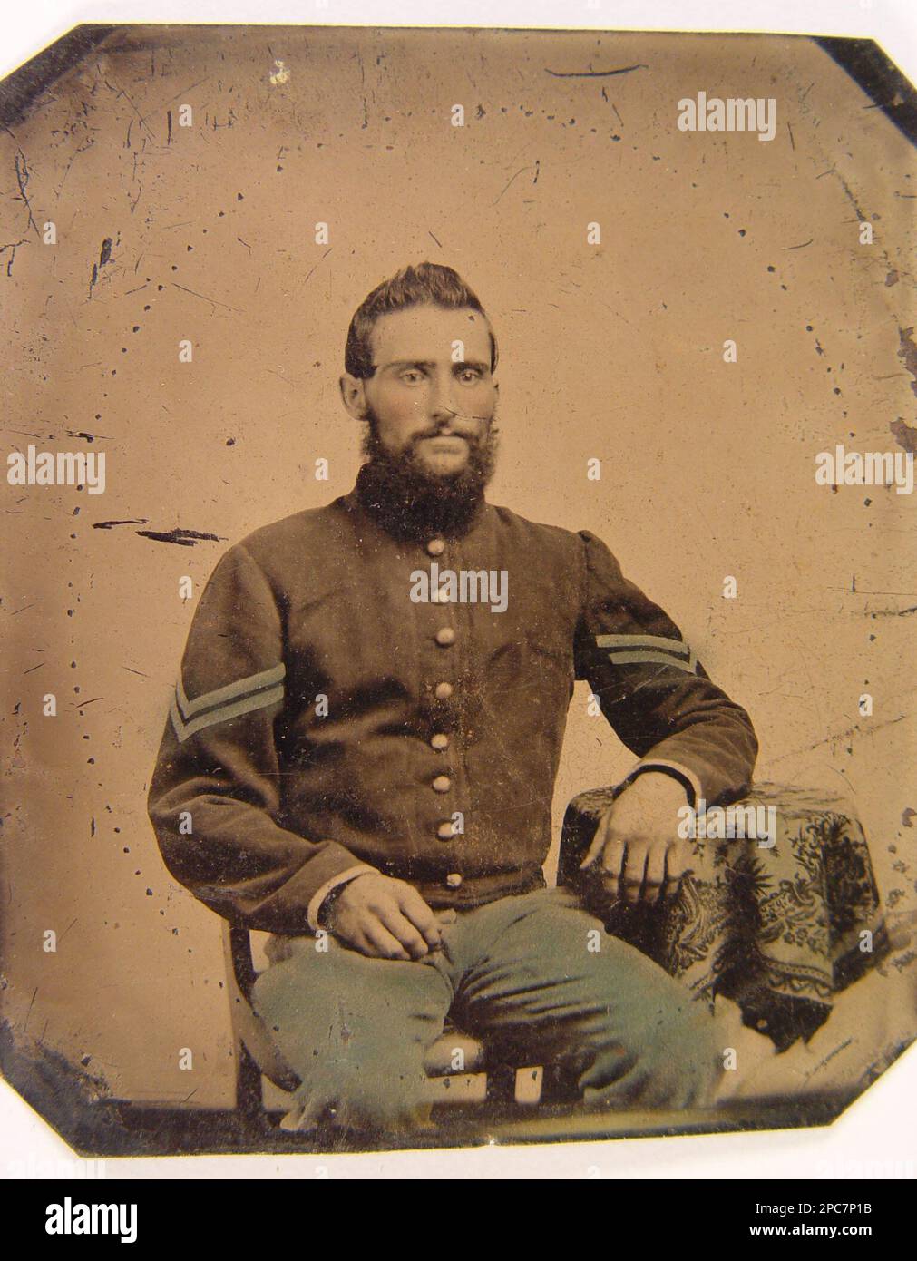 Unidentified soldier in Union infantry corporal's uniform sitting with ...