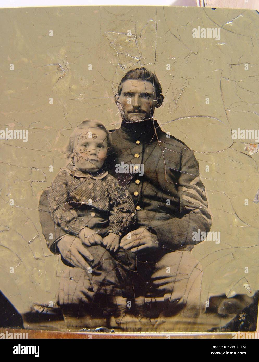 Unidentified soldier in Union first sergeant's uniform with small child ...