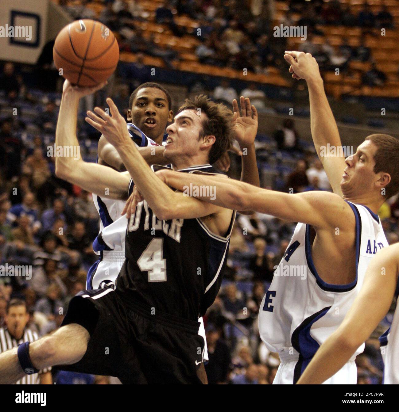 Butler's A.J. Graves (4) puts up a shot as Indiana State's Adam Arnold ...