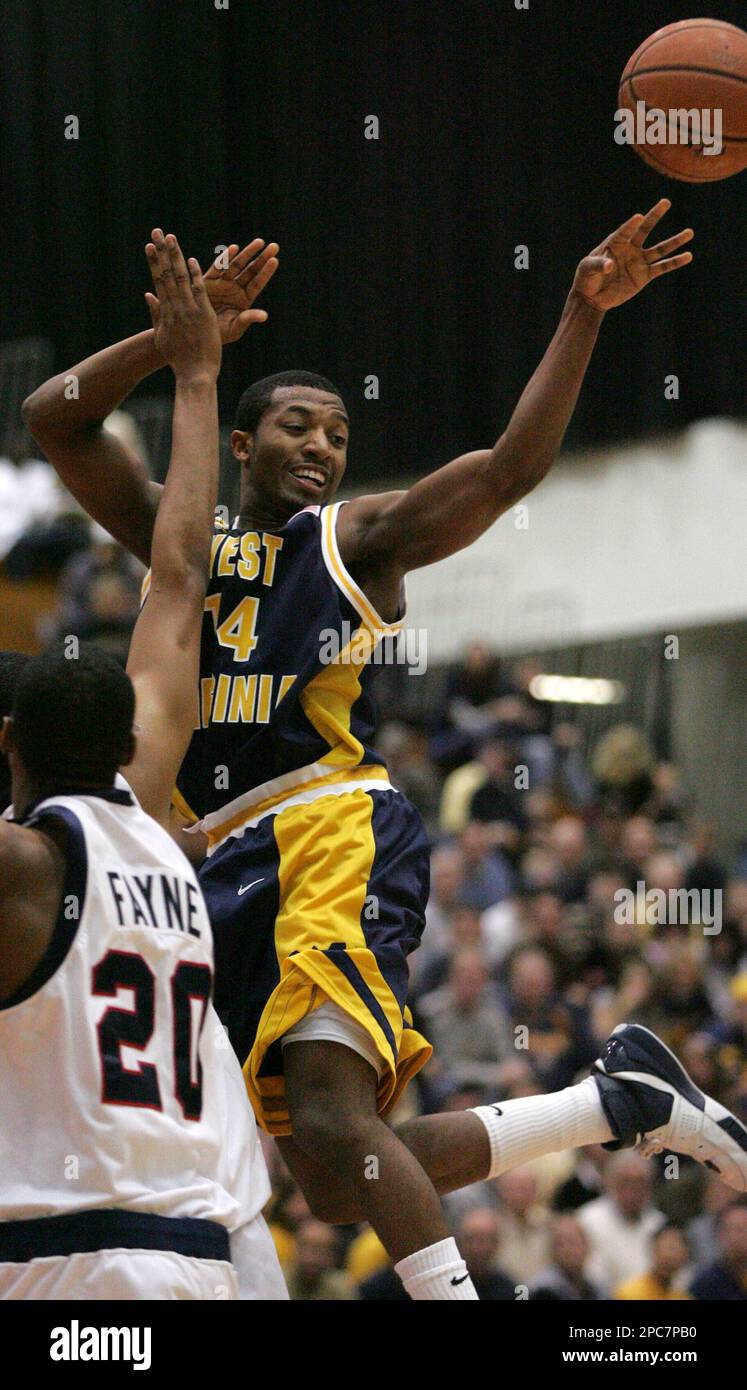 West Virginia's Darris Nichols, top, passes away from Duquesne's ...