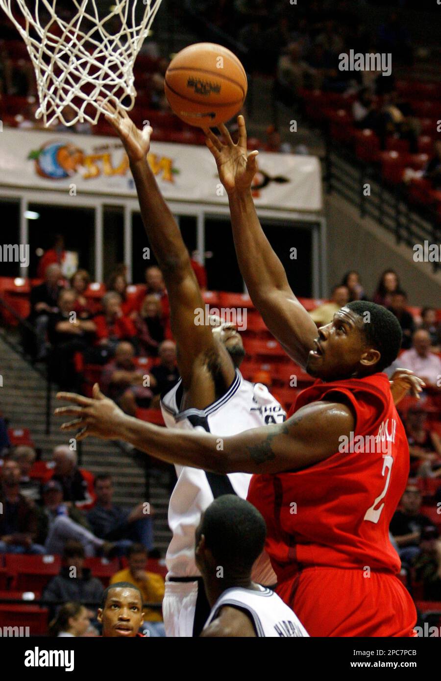 Ball State's Micah Rollin (2) shoots past the block of Oklahoma State's ...