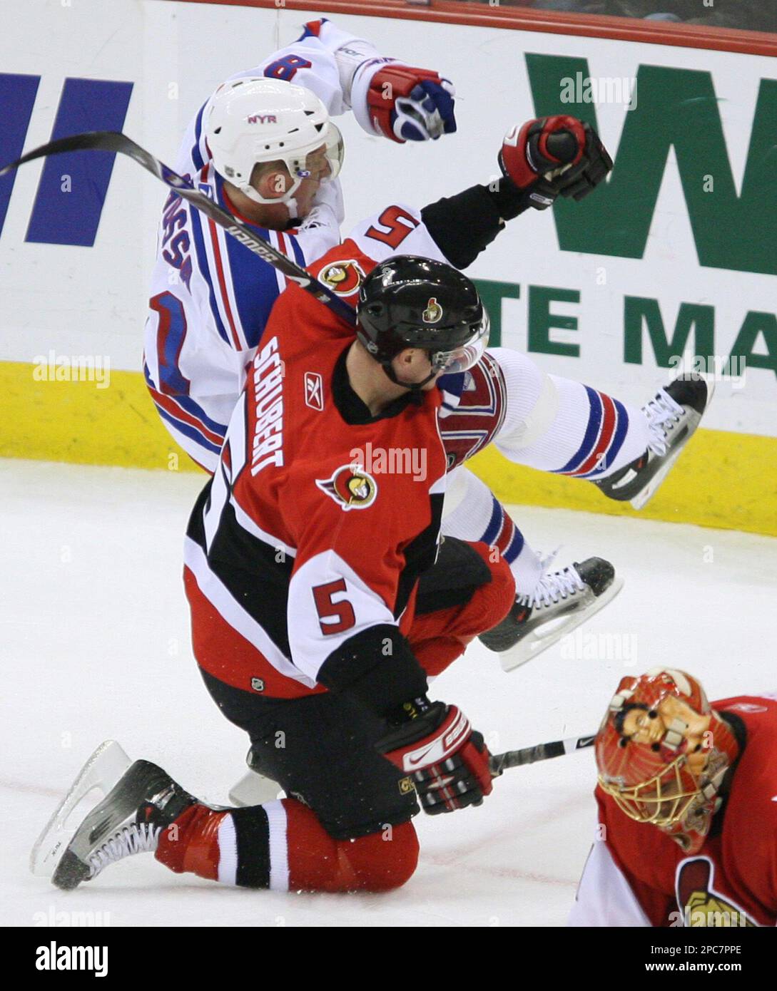 Ottawa Senators' Christoph Schubert (5) battles for the puck with New ...