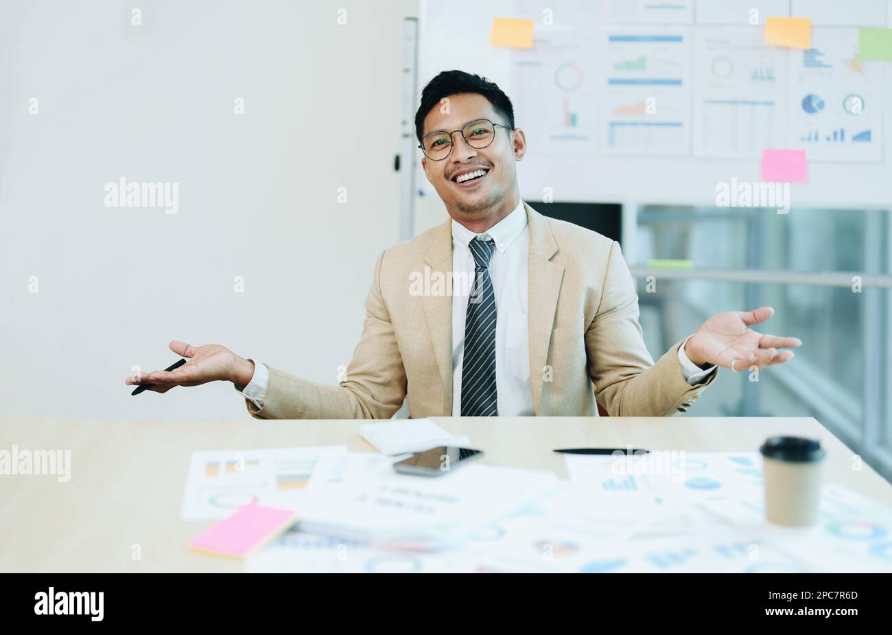 Portrait of a male business owner showing a happy smiling face as he ...