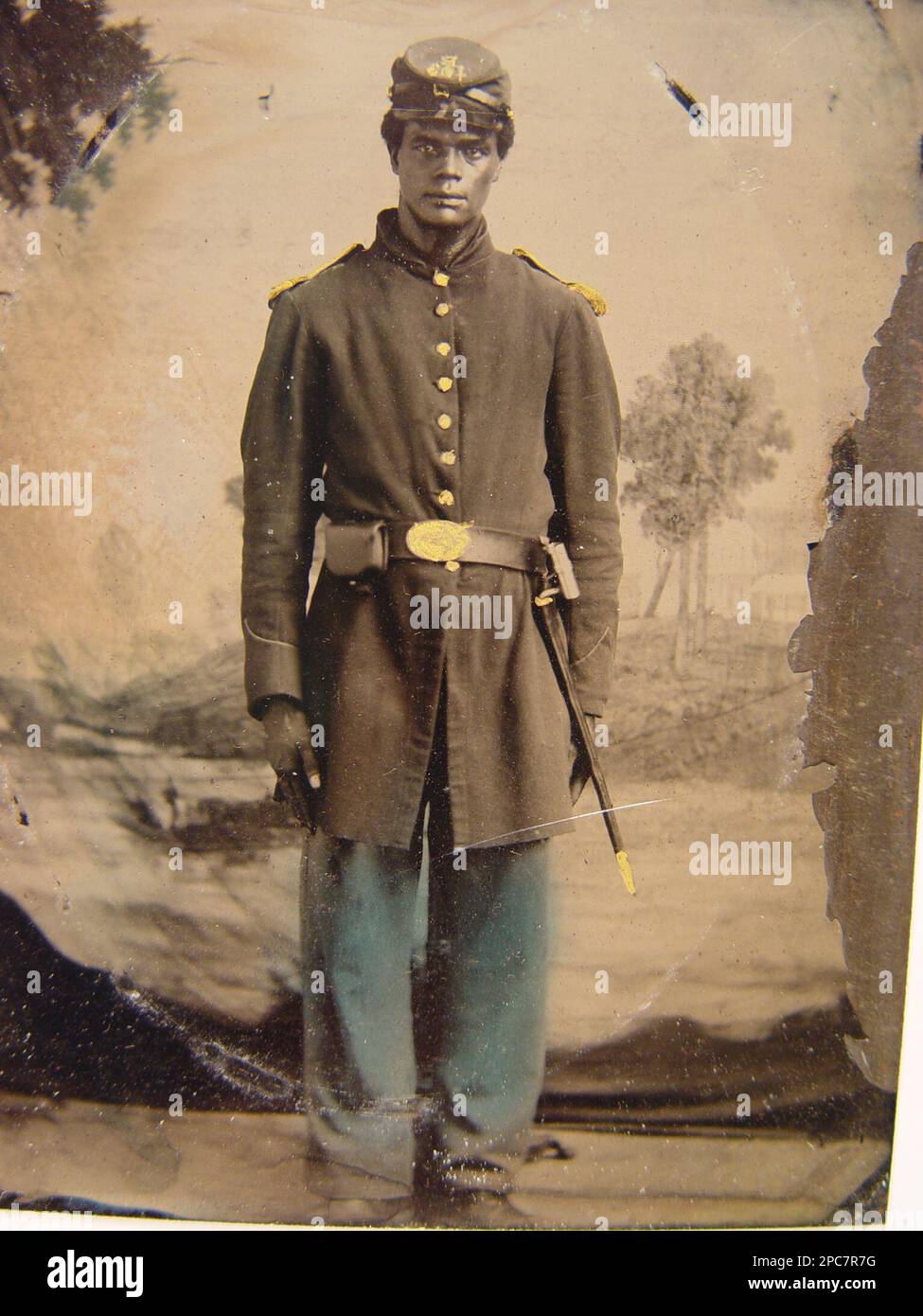 Unidentified African American soldier in Union uniform and Company B, 103rd Regiment forage cap ...