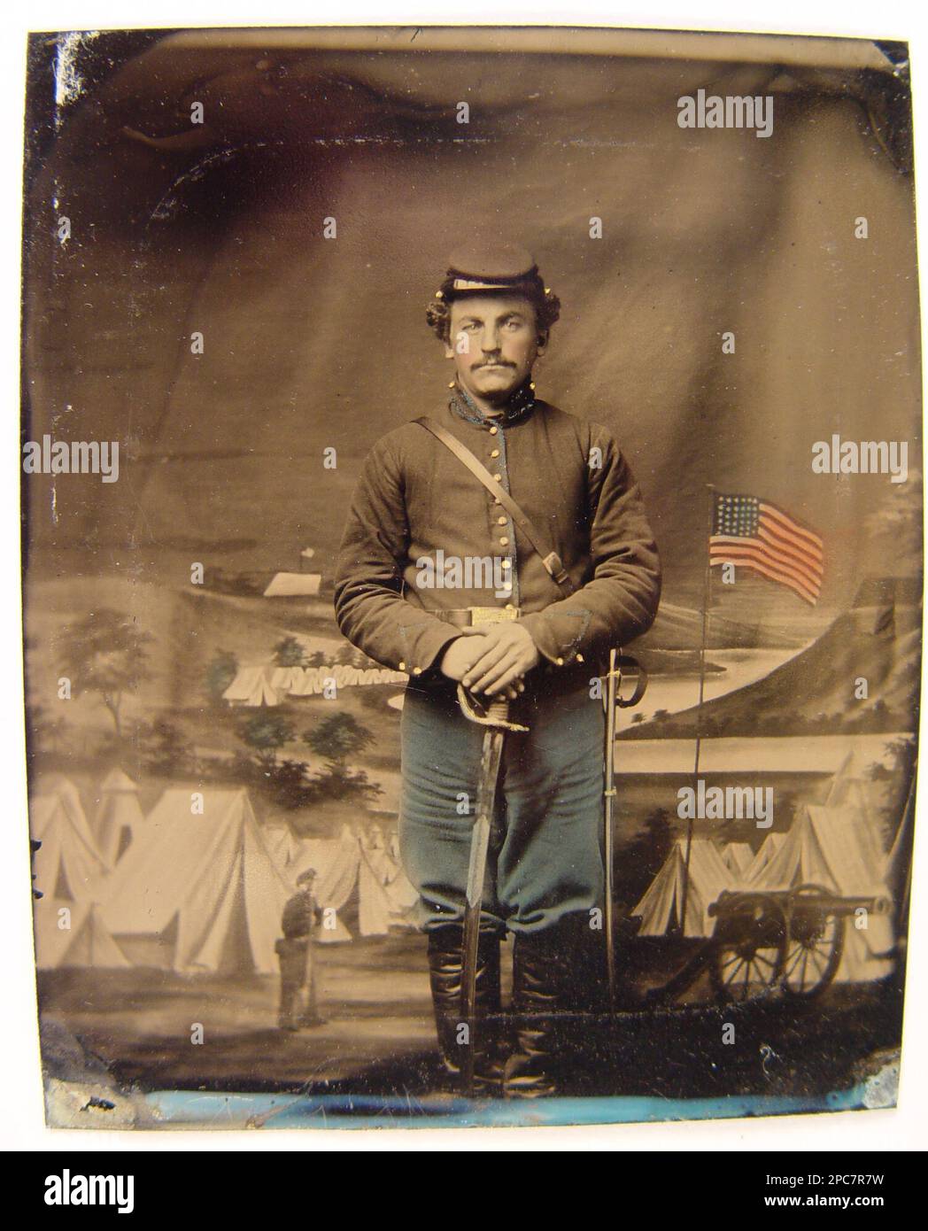 Unidentified soldier in Union uniform with sword in front of painted ...