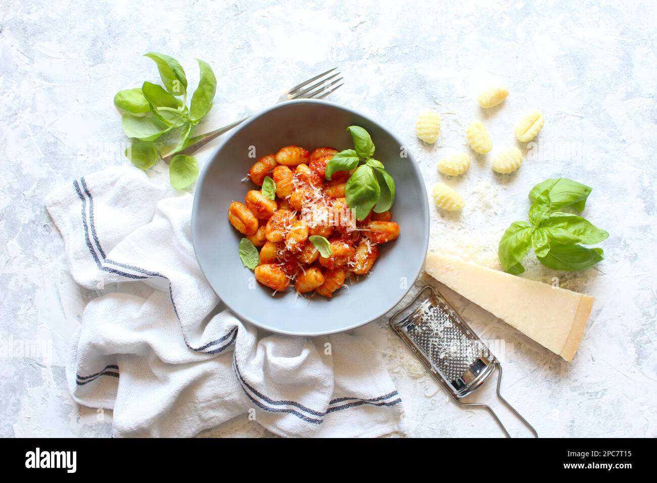 Italian gnocchi with tomato sauce on table. Top view Stock Photo - Alamy