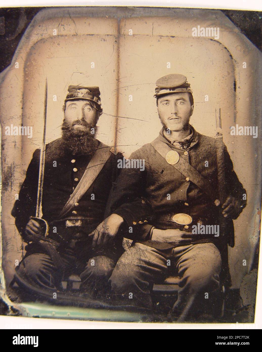 Two unidentified soldiers in Union uniforms and forage caps with saber ...