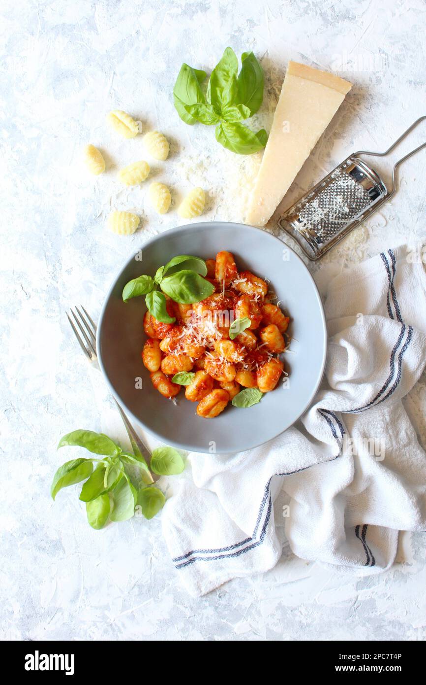 Italian gnocchi with tomato sauce on table. Top view Stock Photo - Alamy