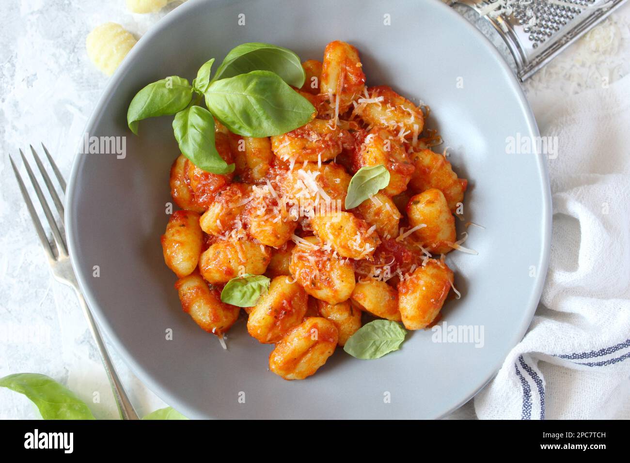 Italian gnocchi with tomato sauce on table. Top view Stock Photo - Alamy