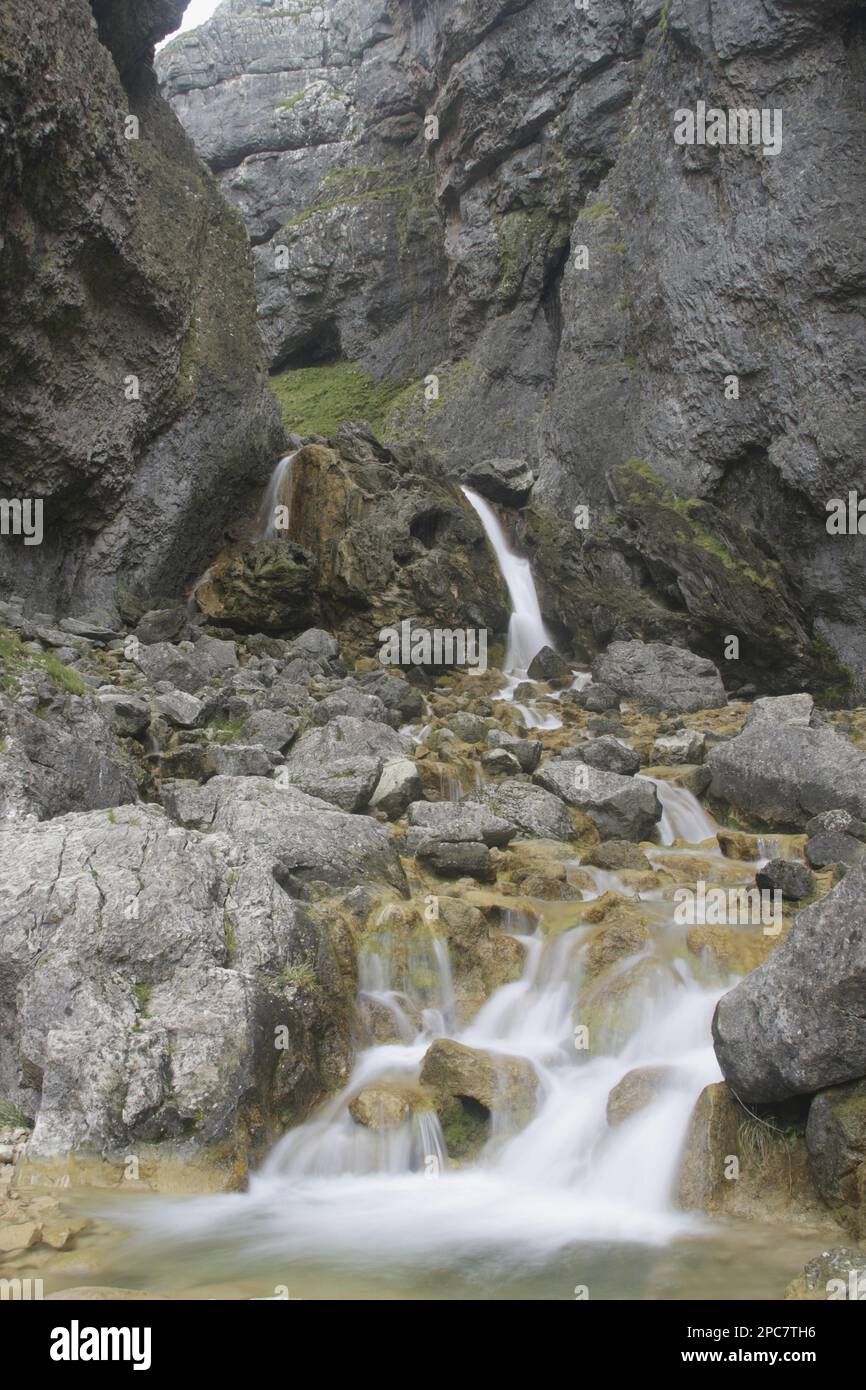 Water flowing through a limestone gorge (glacial channel), Gordale Scar ...